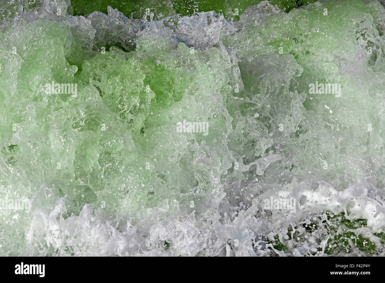Sea wave bubbles and splashes Stock Photo - Alamy