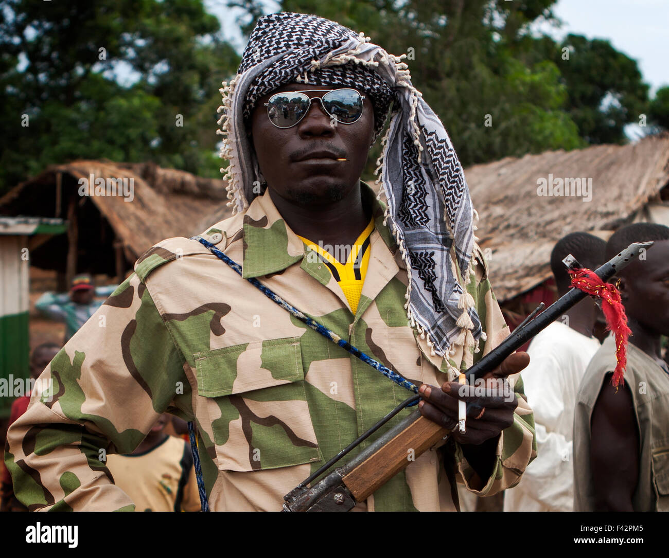 A memeber of the Anti-Balaka poses with his AK-47 at a checkpoint near ...