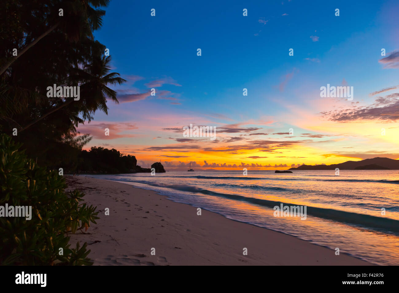 Sunset on tropical beach - Seychelles Stock Photo - Alamy