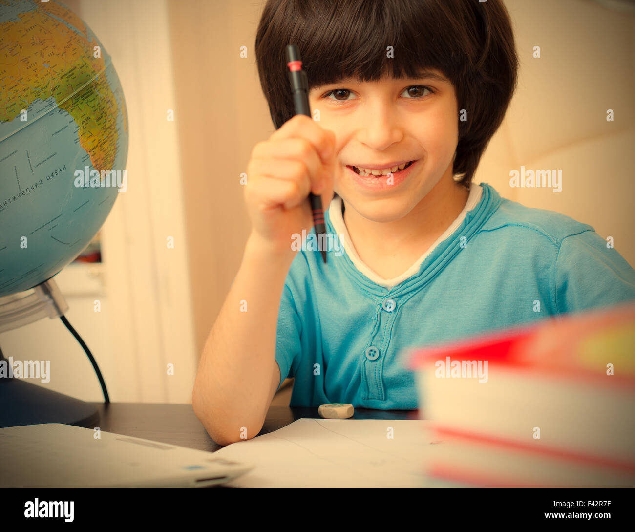 schoolboy doing homework Stock Photo - Alamy
