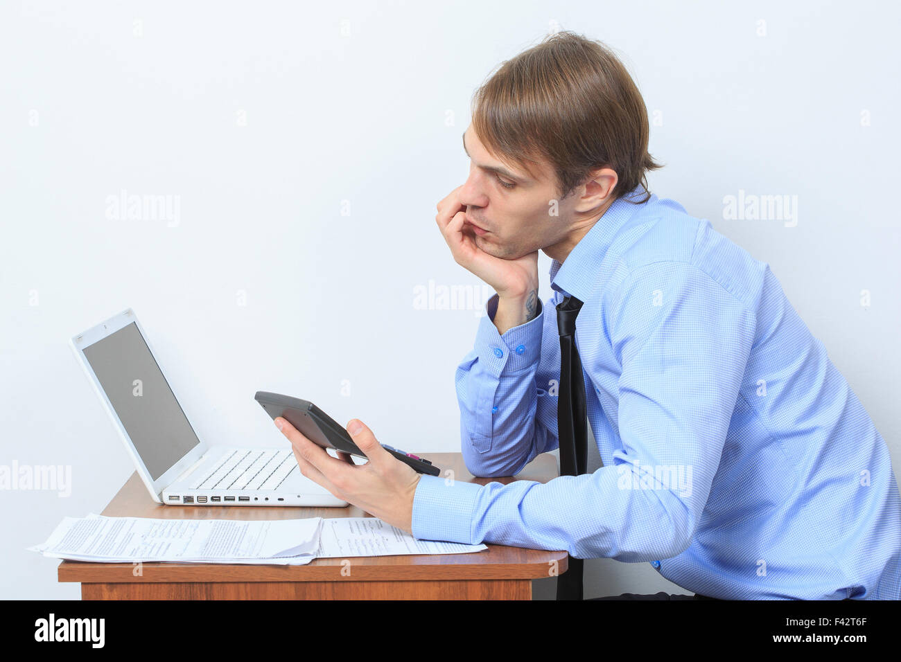 disgruntled manager at his desk Stock Photo - Alamy