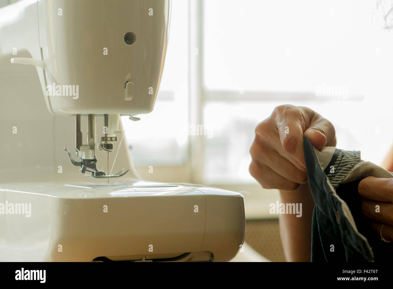 Woman works on sewing machine hi-res stock photography and images - Alamy