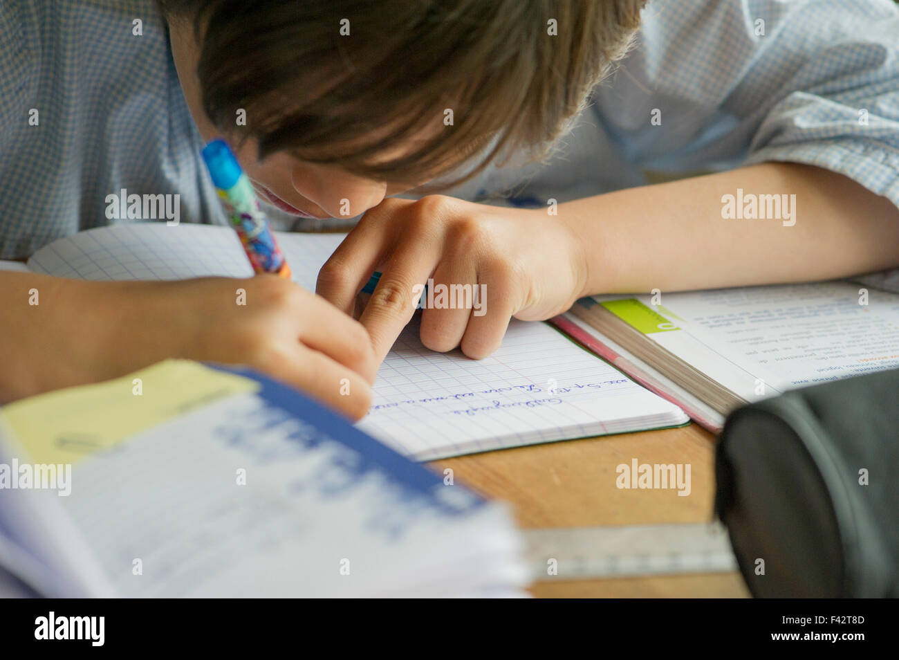 Boy doing homework Stock Photo - Alamy