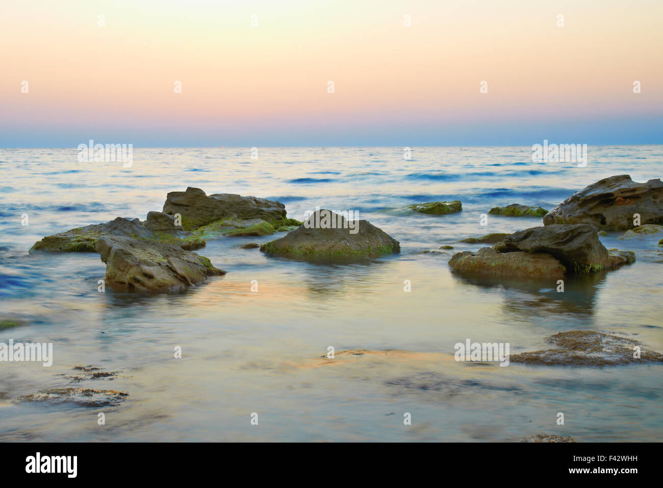 Rocks in the sea Stock Photo - Alamy