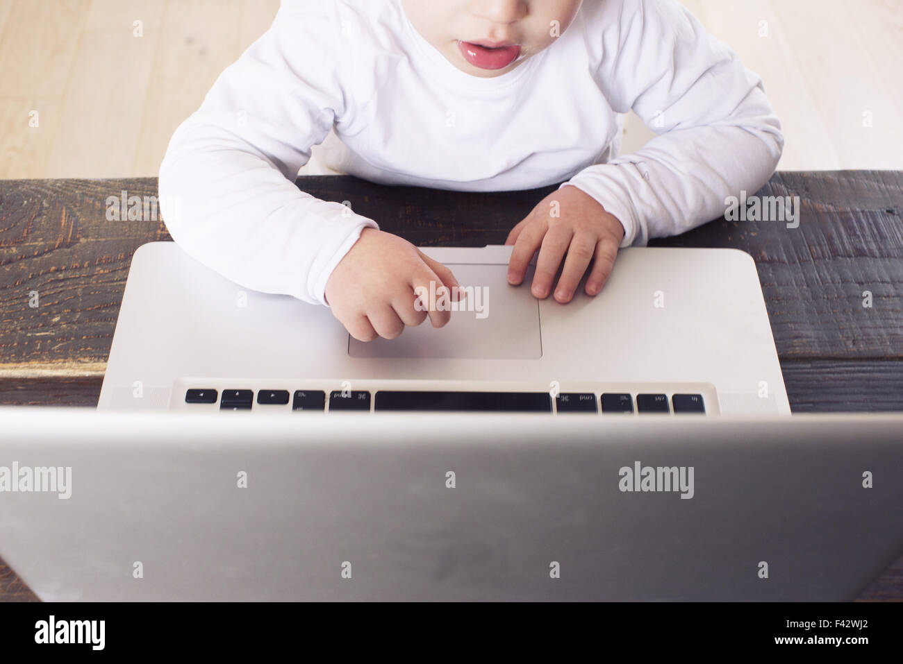Little boy using laptop computer, cropped Stock Photo - Alamy