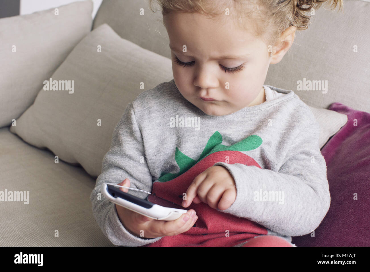 Kids children smartphone cell phones hi-res stock photography and ...