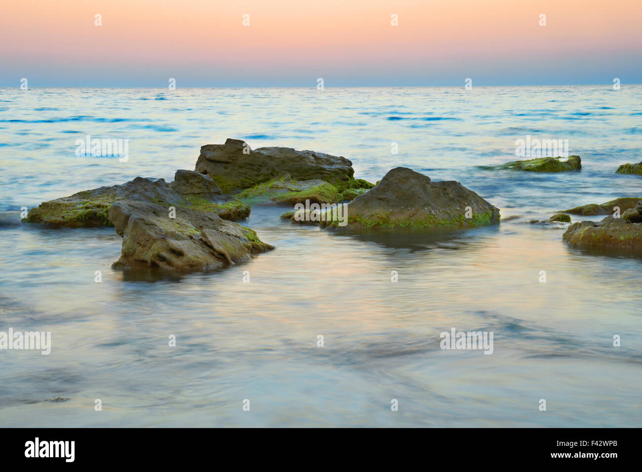 Rocks in the sea Stock Photo - Alamy