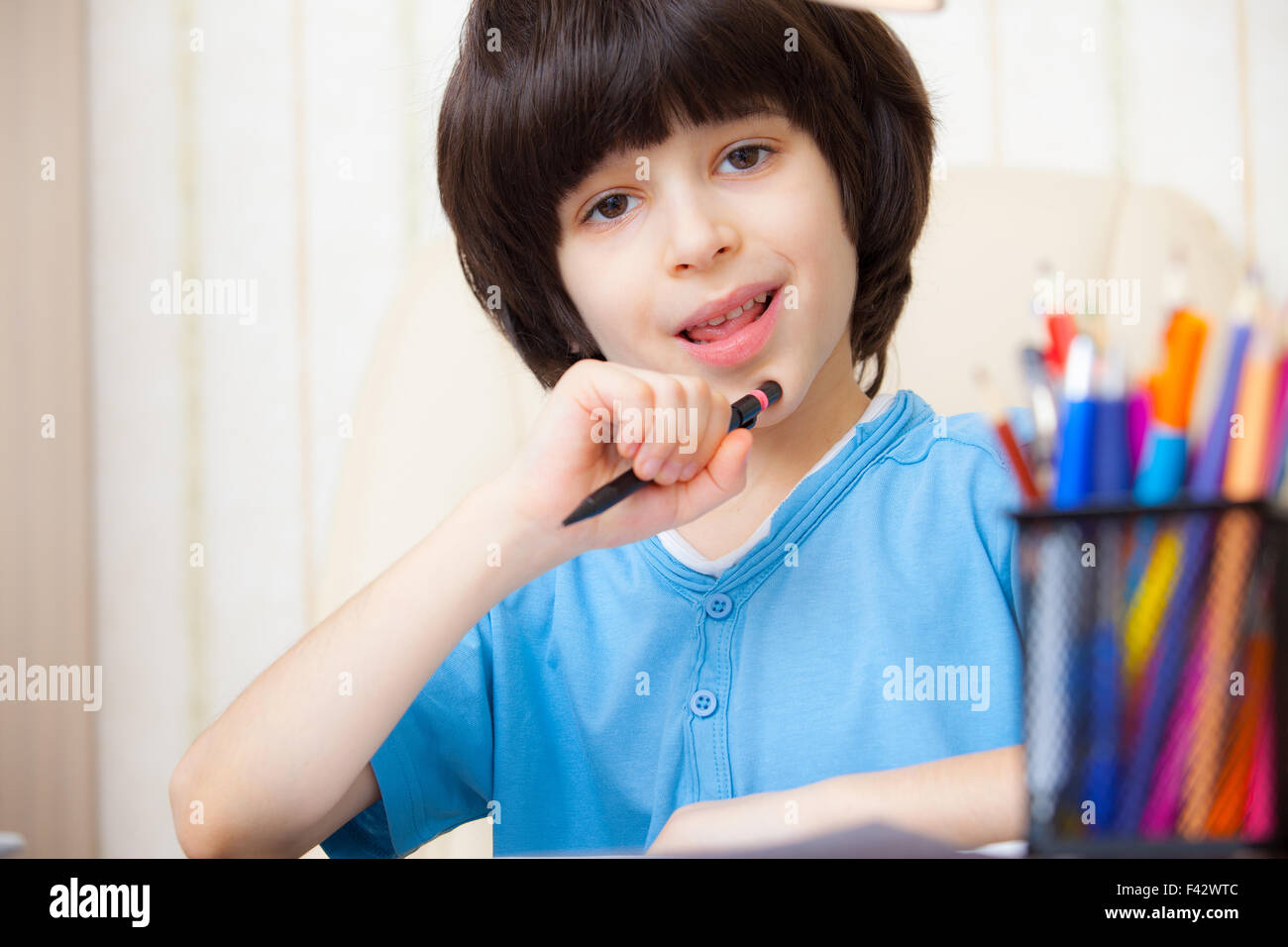 Boy doing homework Stock Photo - Alamy
