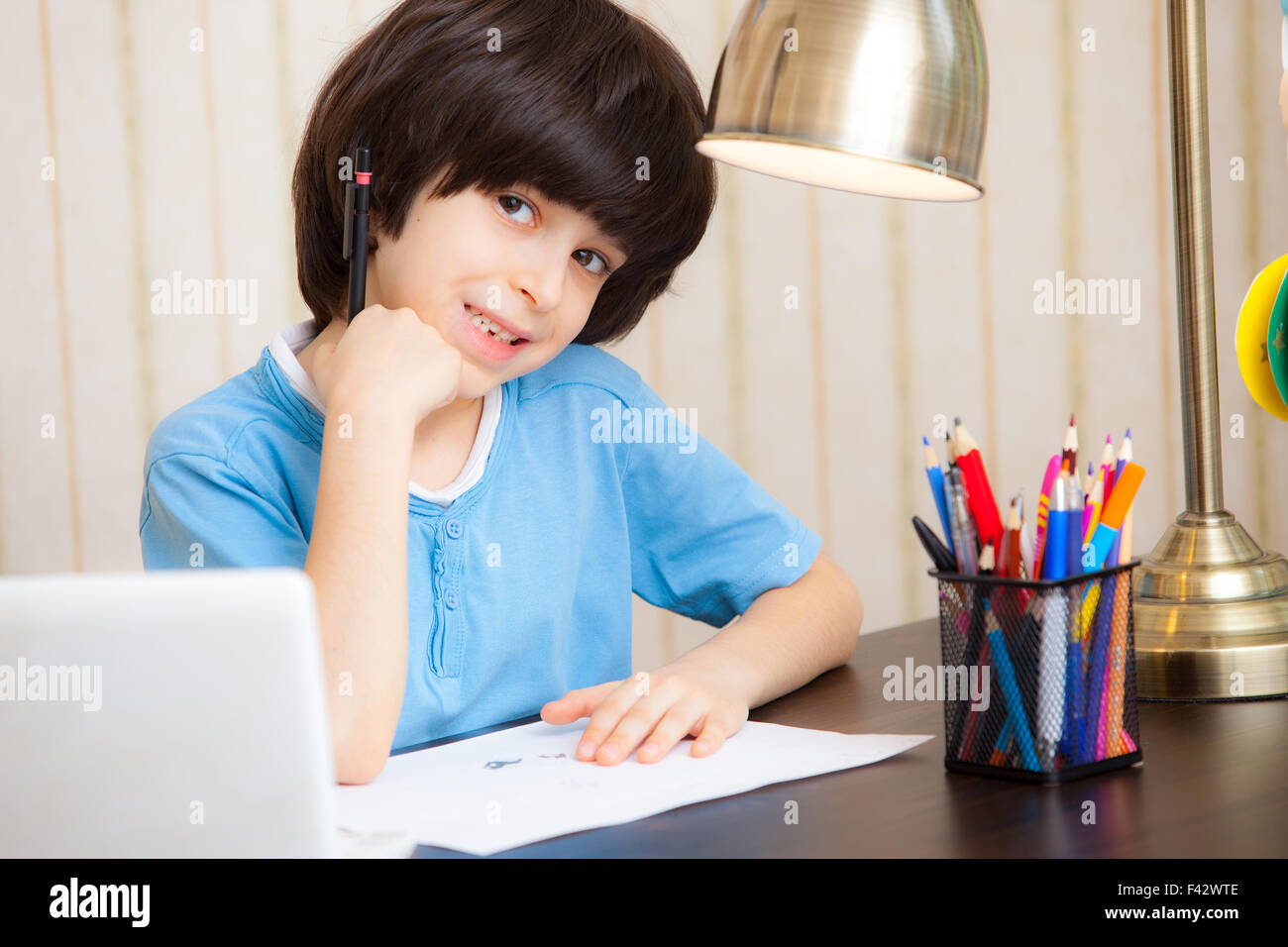 child doing homework with computer, portrait Stock Photo - Alamy