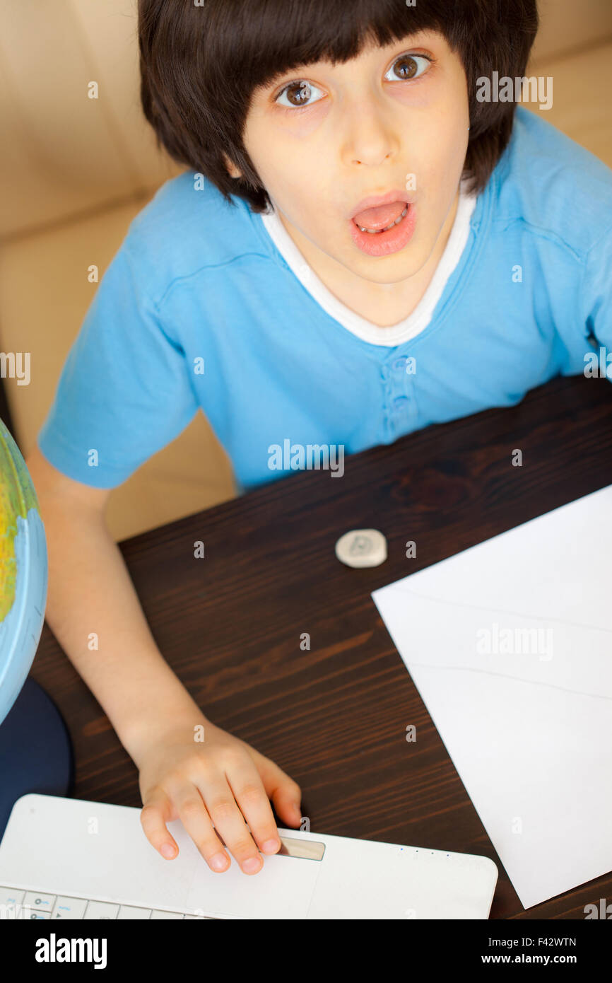 schoolboy doing homework Stock Photo - Alamy