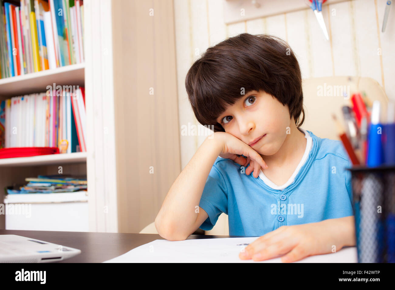 schoolboy doing homework Stock Photo - Alamy
