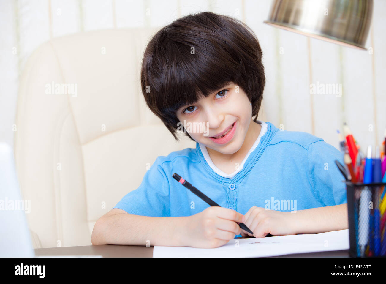 child doing homework with computer, portrait Stock Photo - Alamy