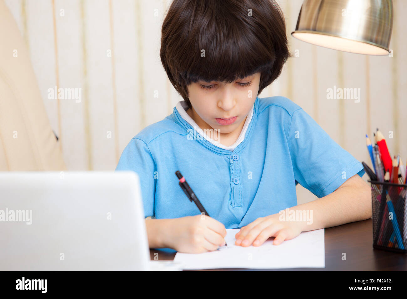 child doing homework Stock Photo - Alamy