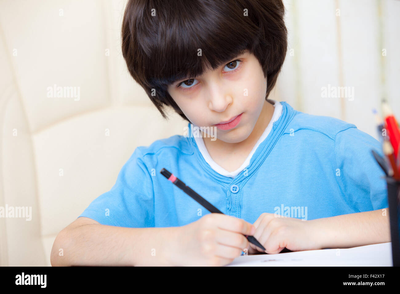 schoolboy doing homework Stock Photo - Alamy