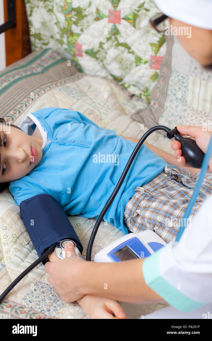 Doctor measure blood pressure Stock Photo - Alamy