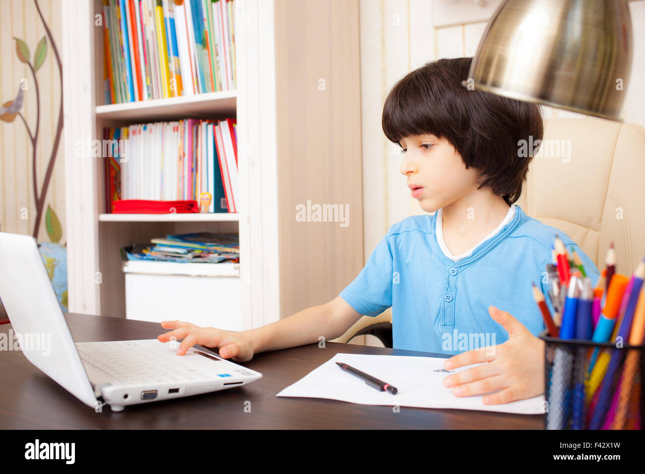 schoolboy doing homework Stock Photo - Alamy