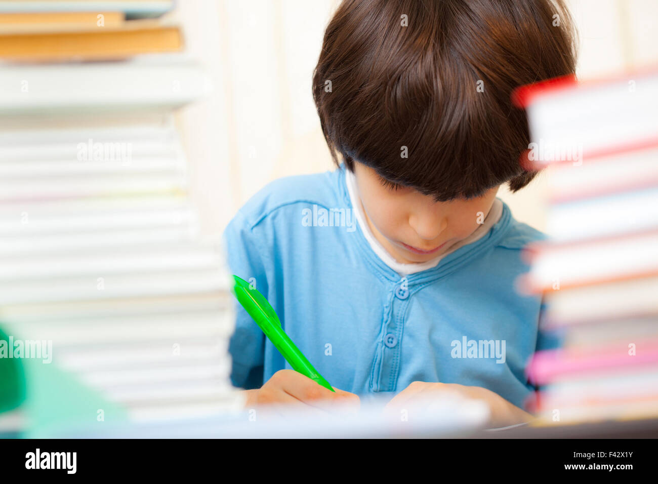schoolboy doing homework Stock Photo - Alamy