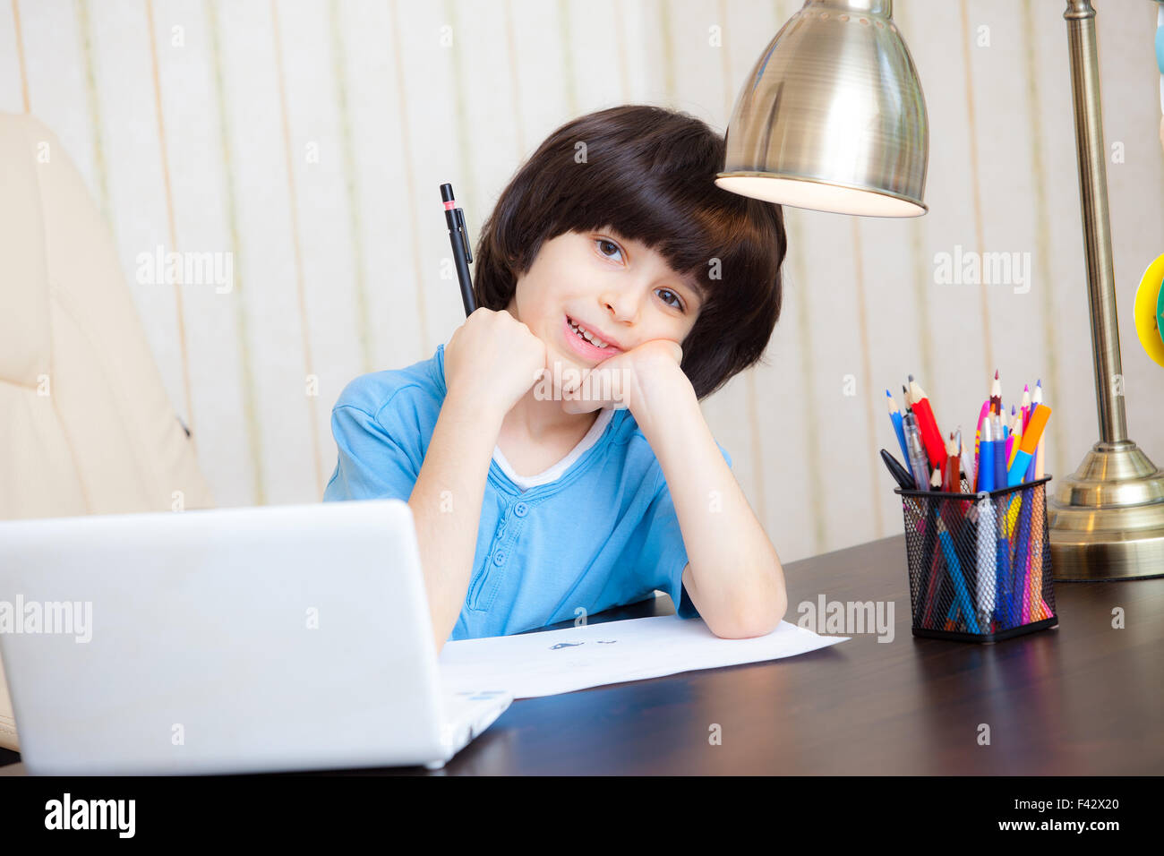schoolboy doing homework Stock Photo - Alamy