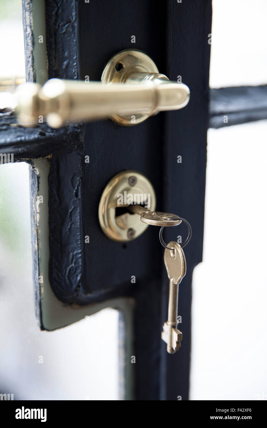 Key in door lock, close-up Stock Photo - Alamy