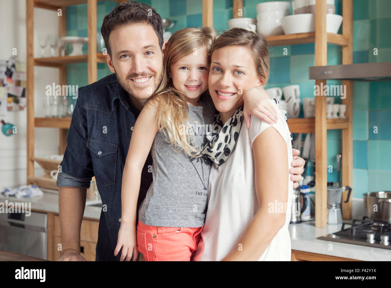Family at home together in kitchen, portrait Stock Photo - Alamy