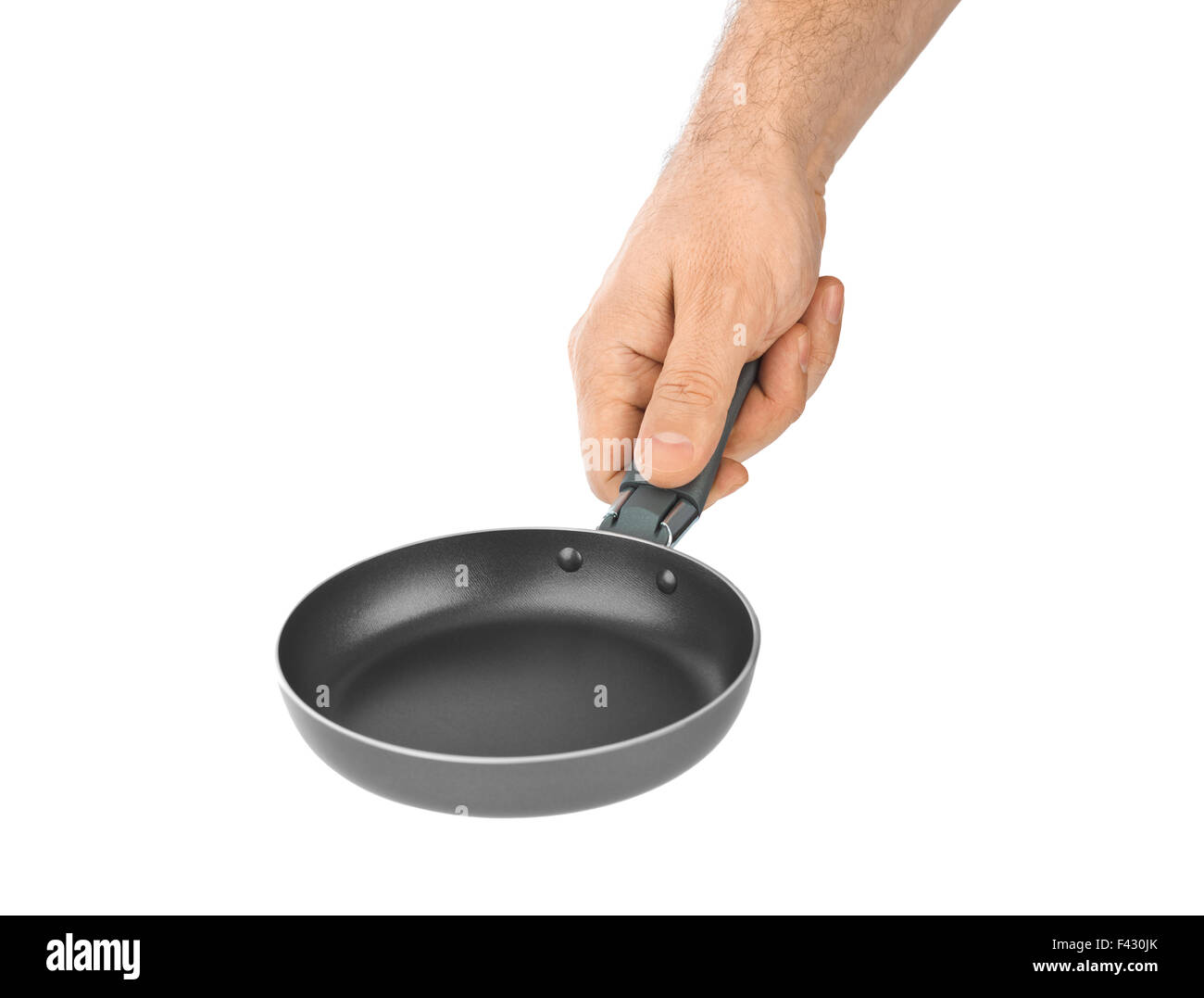 Hand with frying pan Stock Photo - Alamy