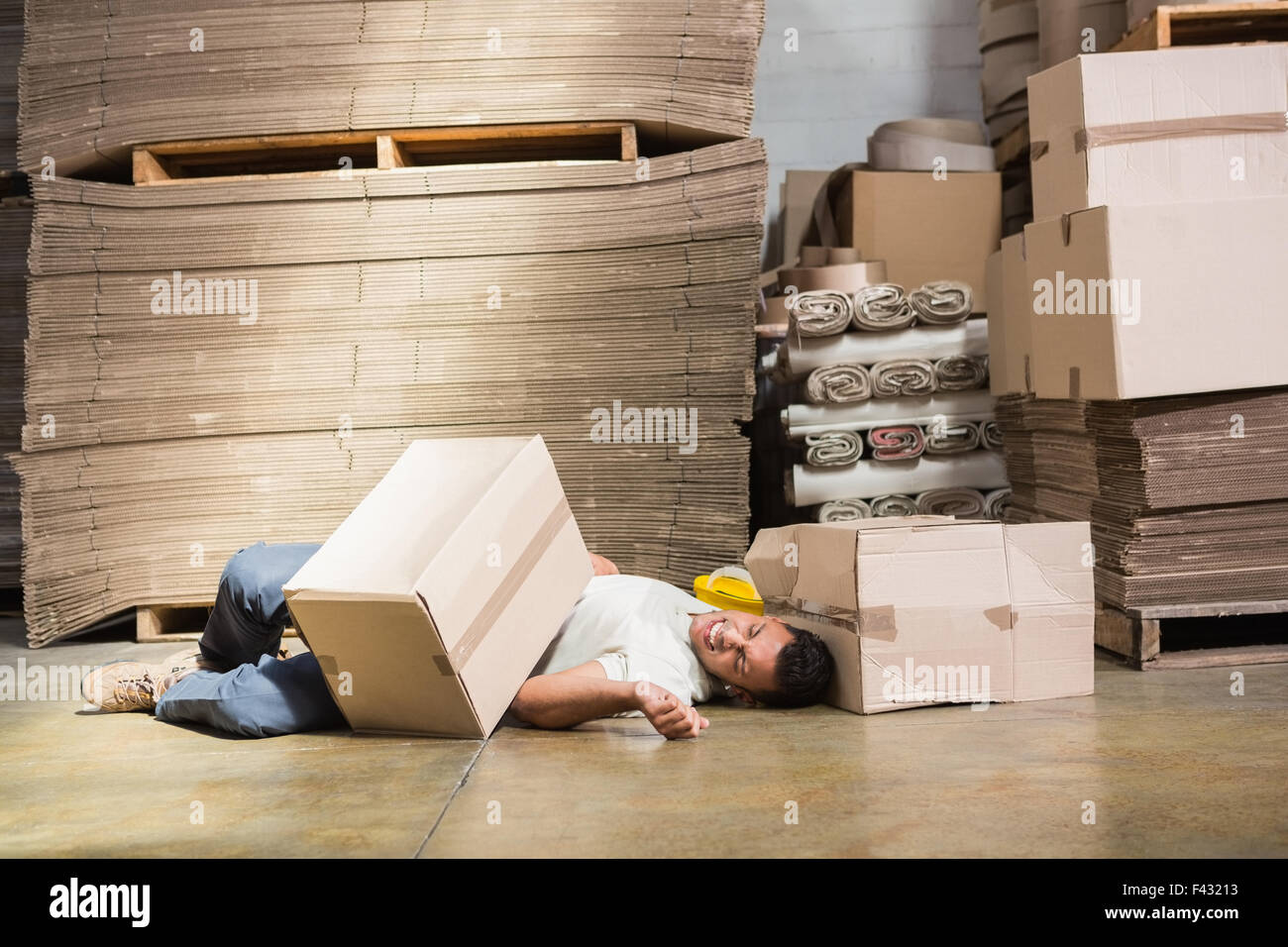 Worker lying on the floor Stock Photo - Alamy