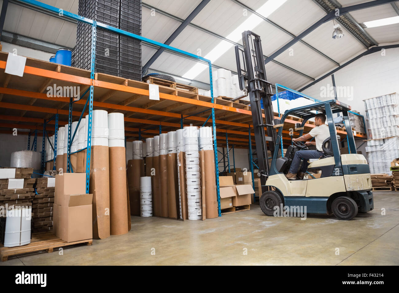 Forklift machine in a large warehouse Stock Photo - Alamy
