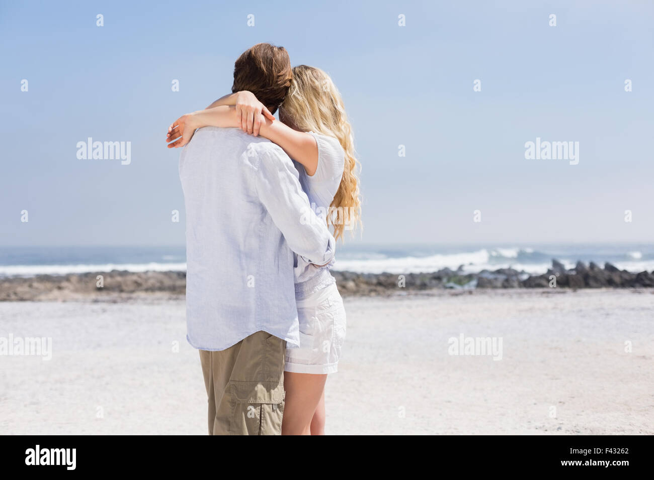 Cute couple hugging on the beach Stock Photo - Alamy
