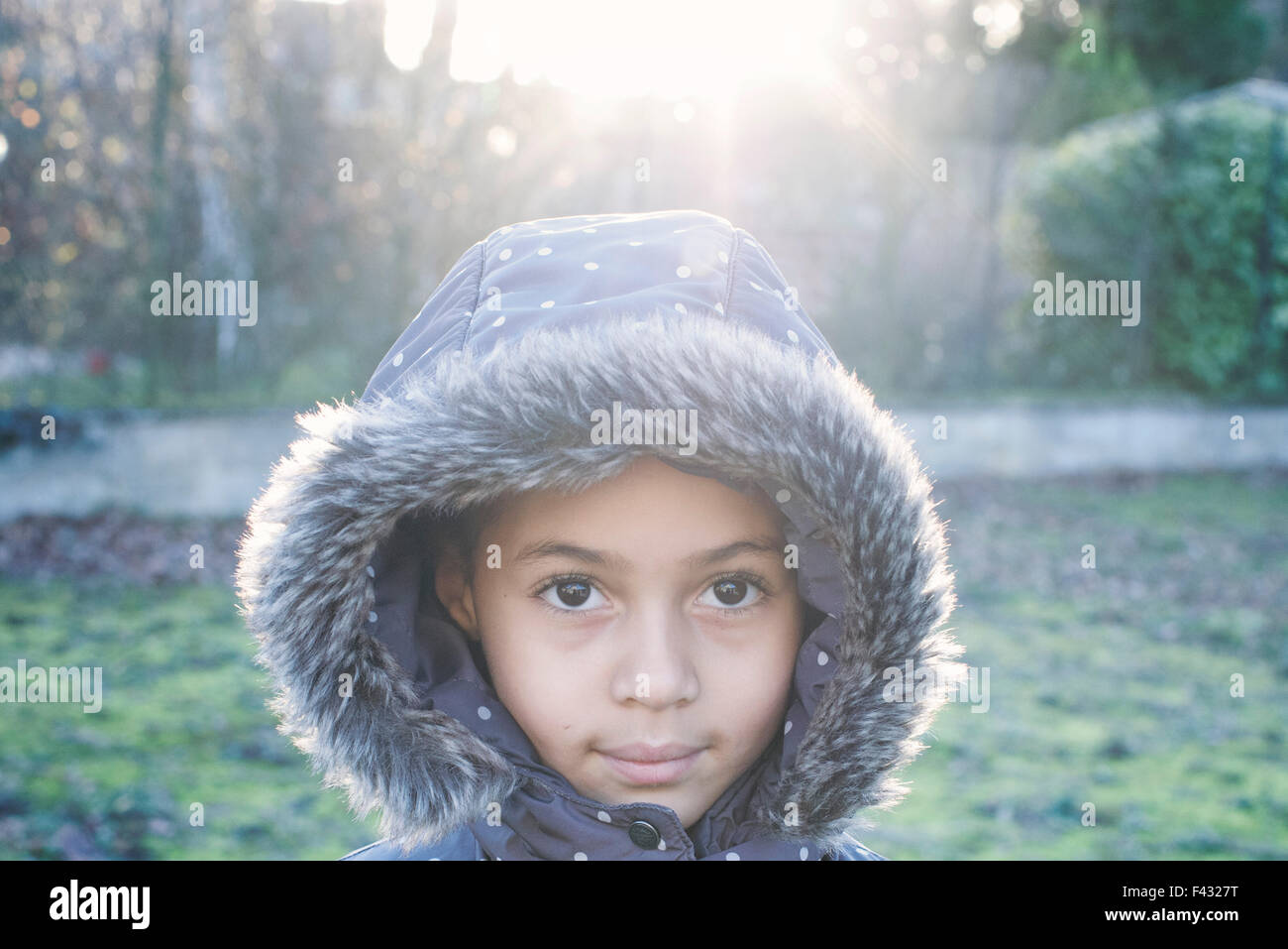 Girl wearing hooded coat, portrait Stock Photo - Alamy