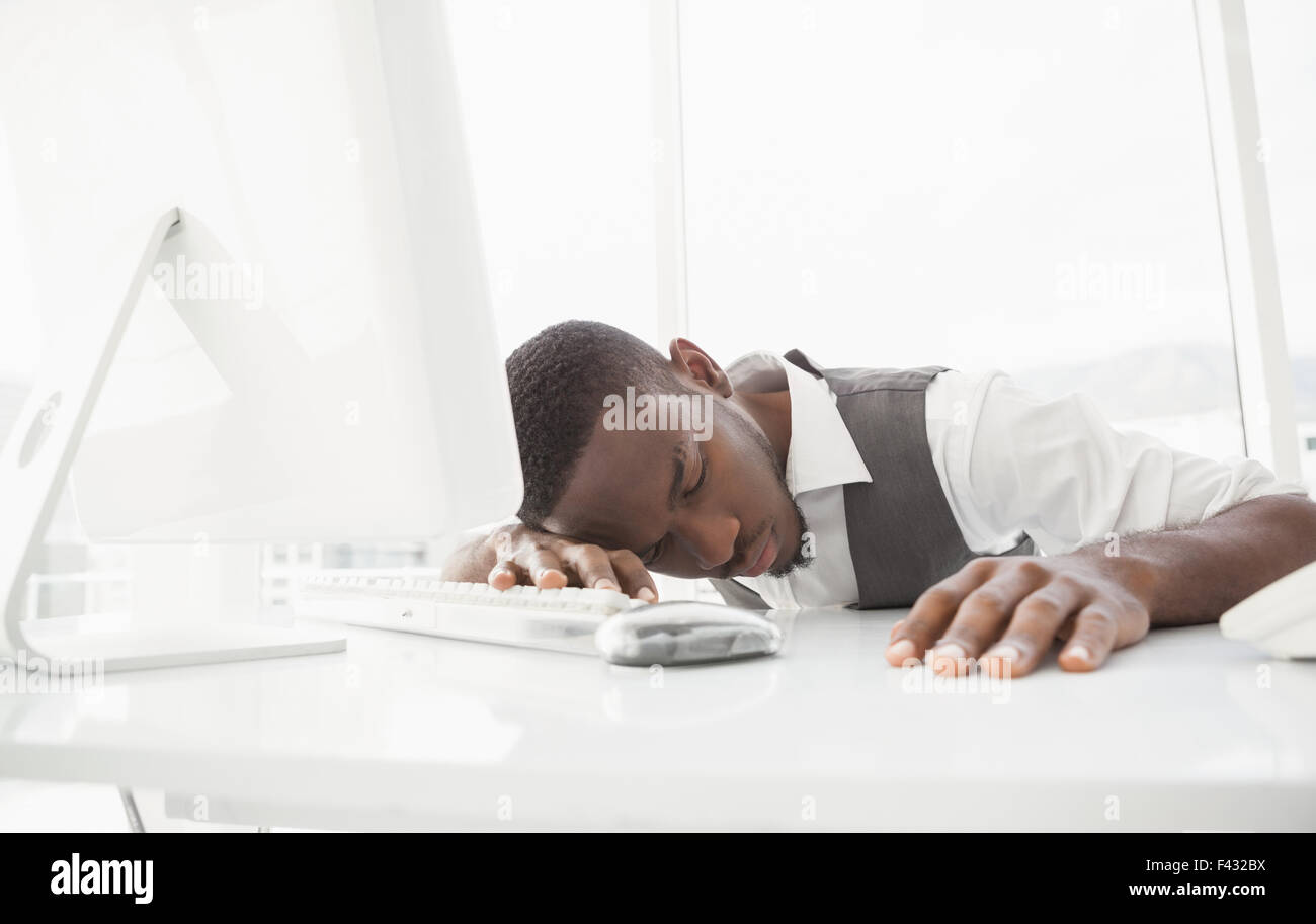 Tired businessman sleeping on keyboard Stock Photo - Alamy