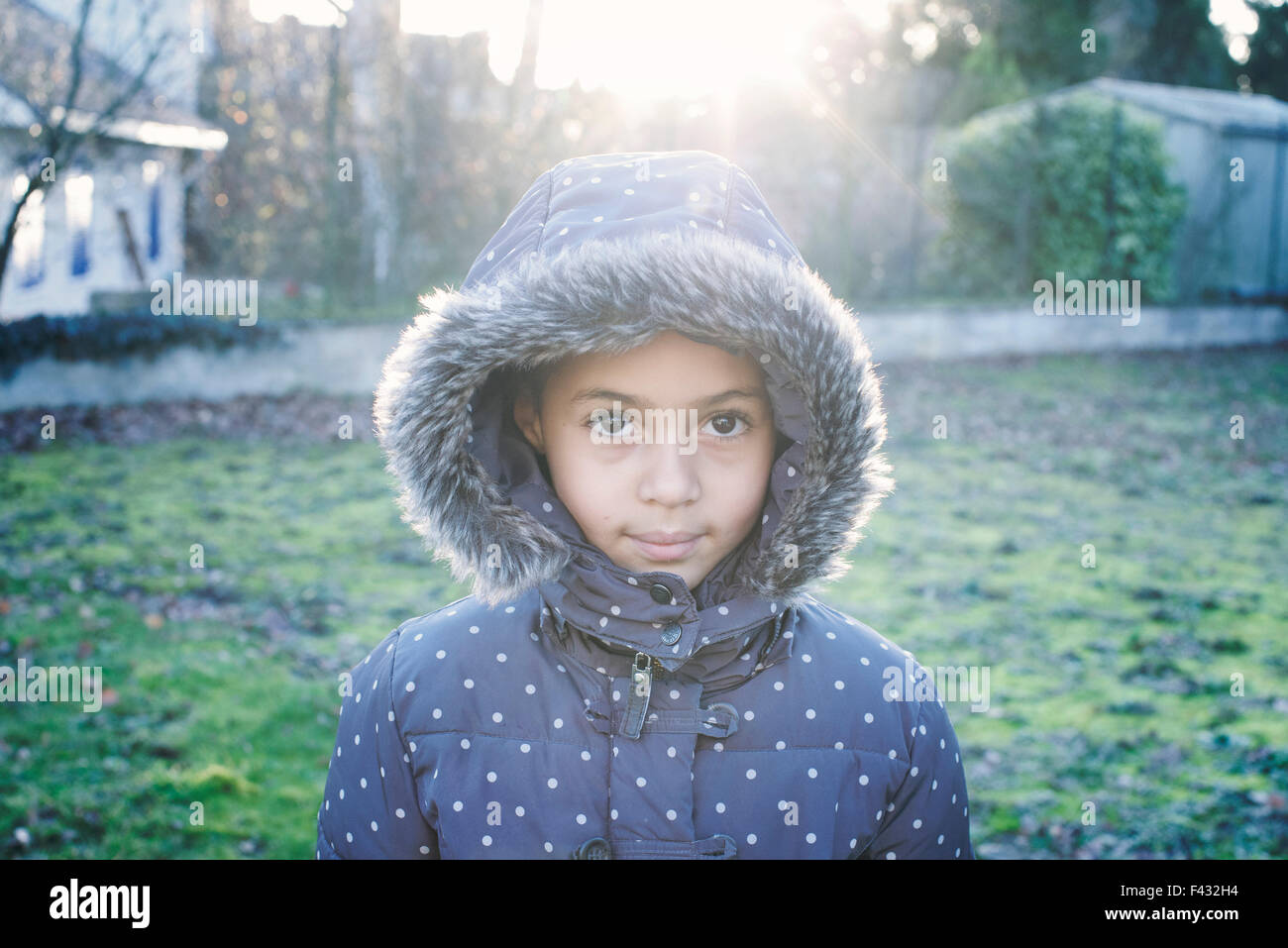 Girl wearing hooded coat, portrait Stock Photo - Alamy