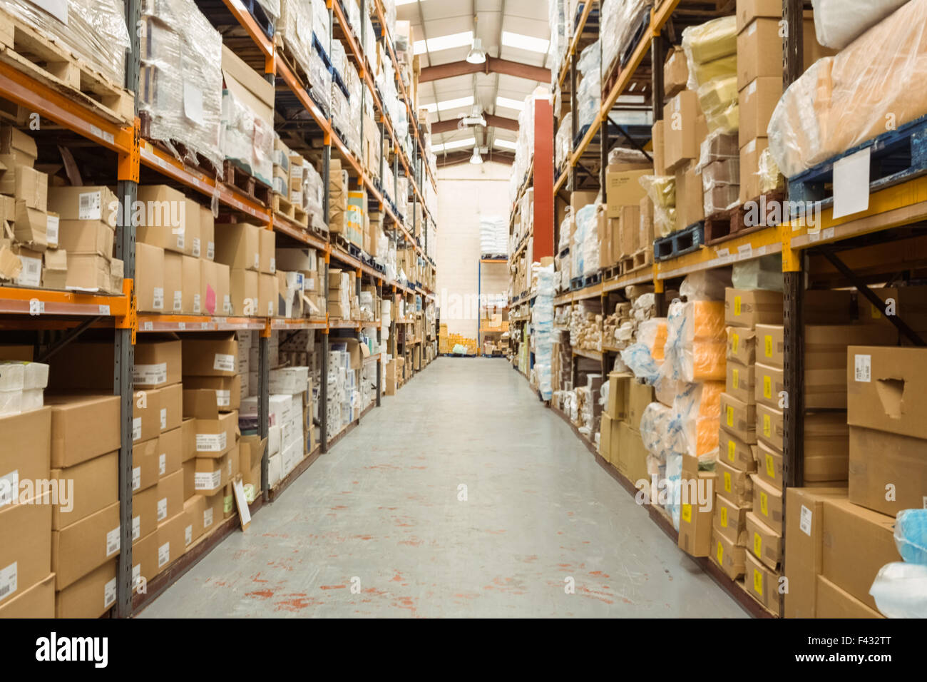 Shelves with boxes in warehouse Stock Photo - Alamy