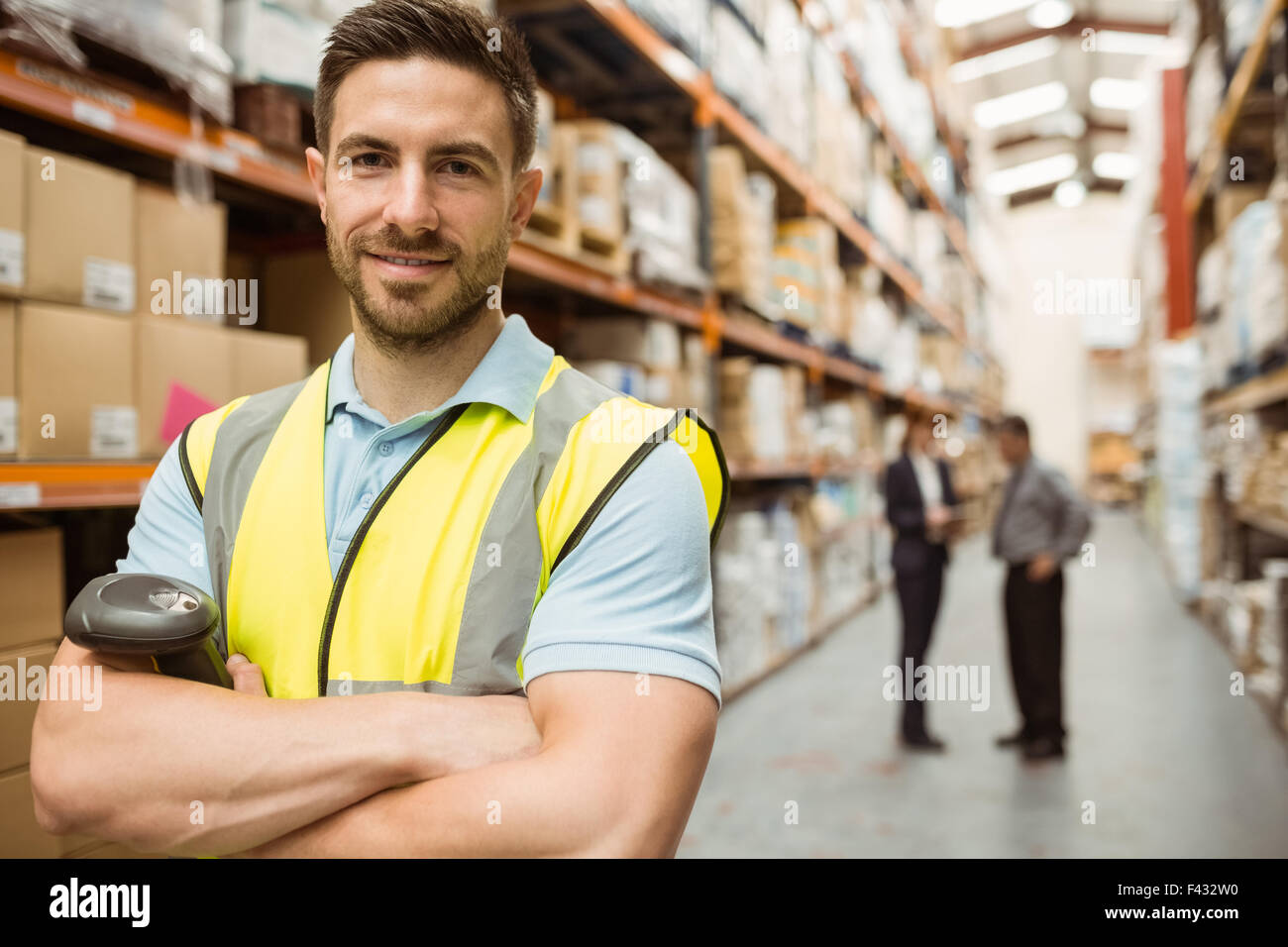 Portrait warehouse team standing arms hi-res stock photography and ...