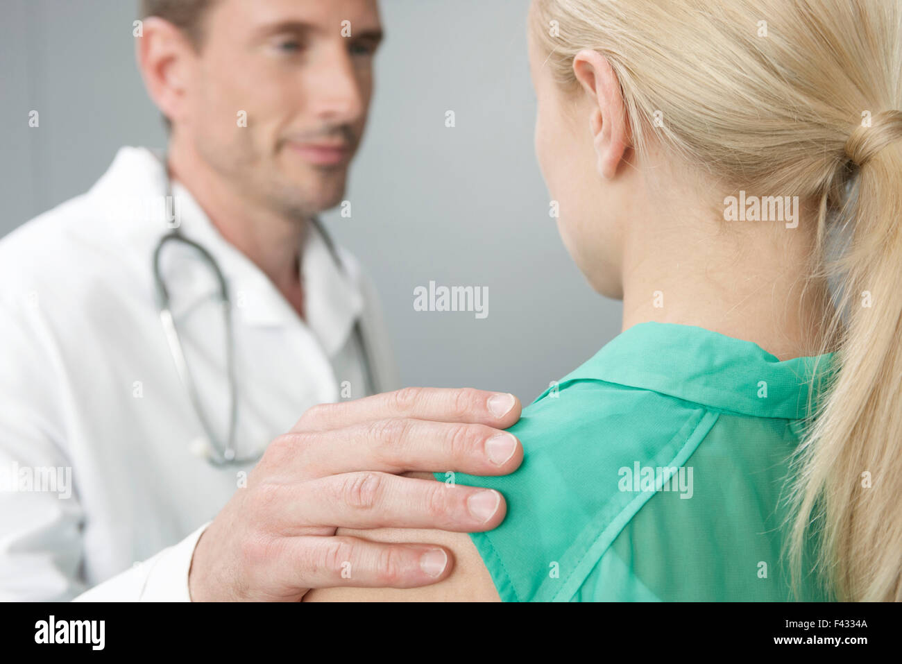 Doctor reassuring patient Stock Photo - Alamy