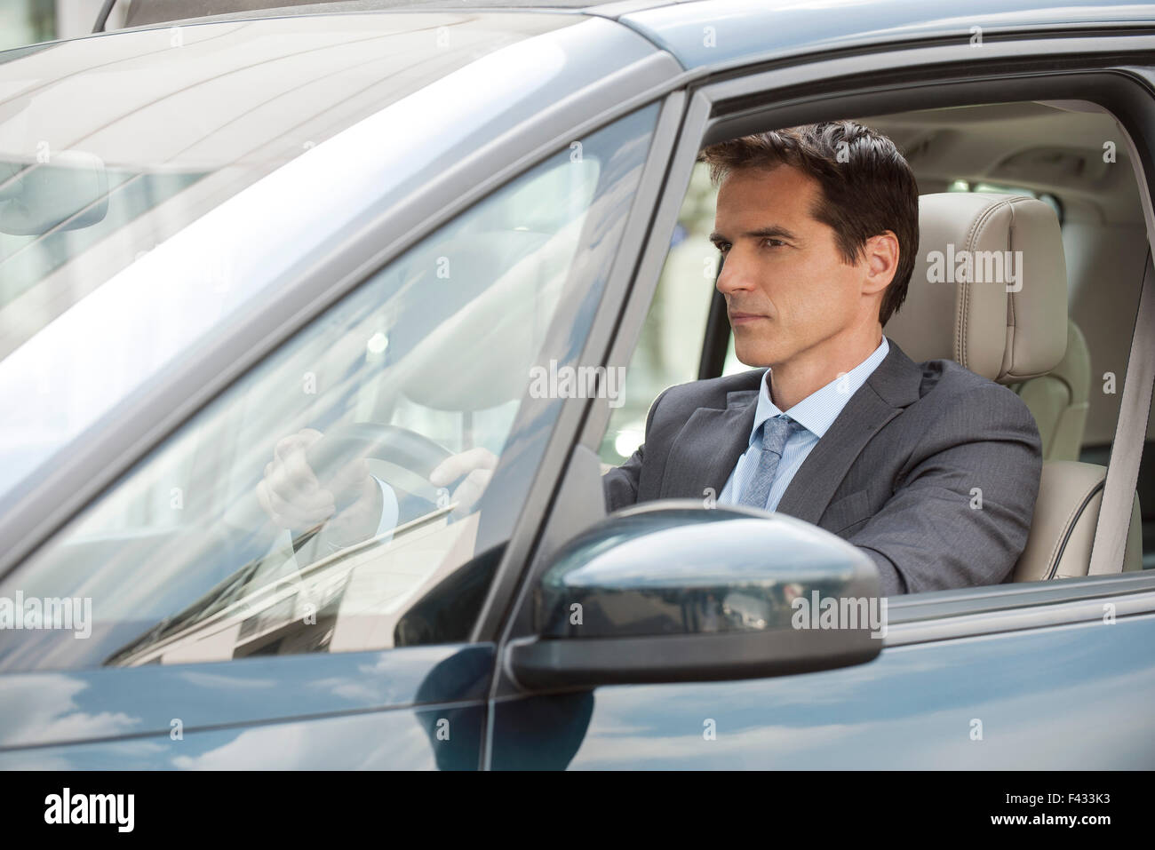 Commuter driving car Stock Photo - Alamy