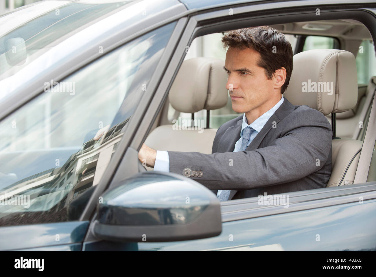 Man driving car Stock Photo - Alamy