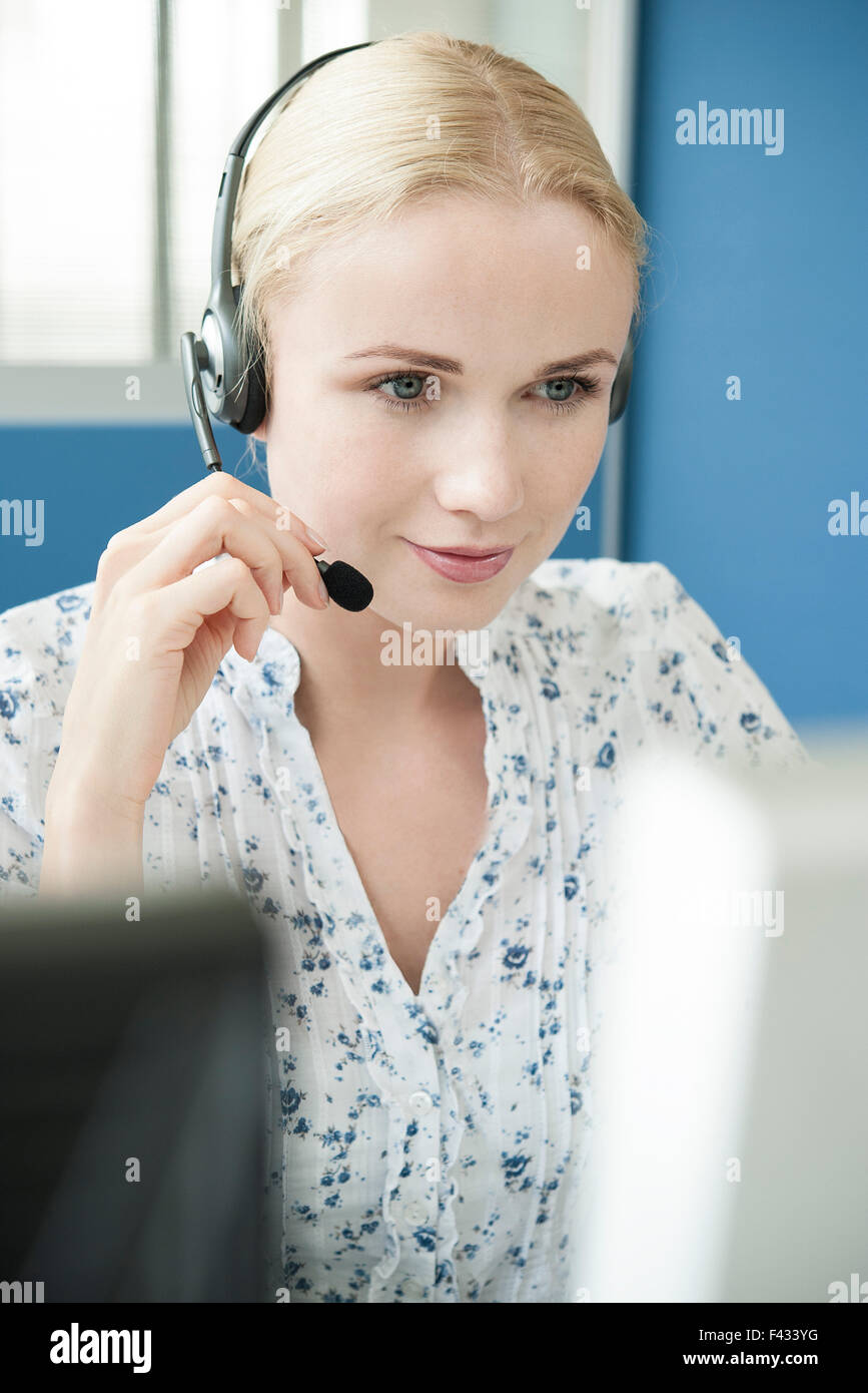 Receptionist on phone call Stock Photo - Alamy