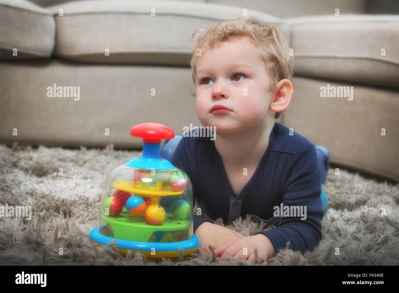 Little boy playing with their favorite toys Stock Photo - Alamy