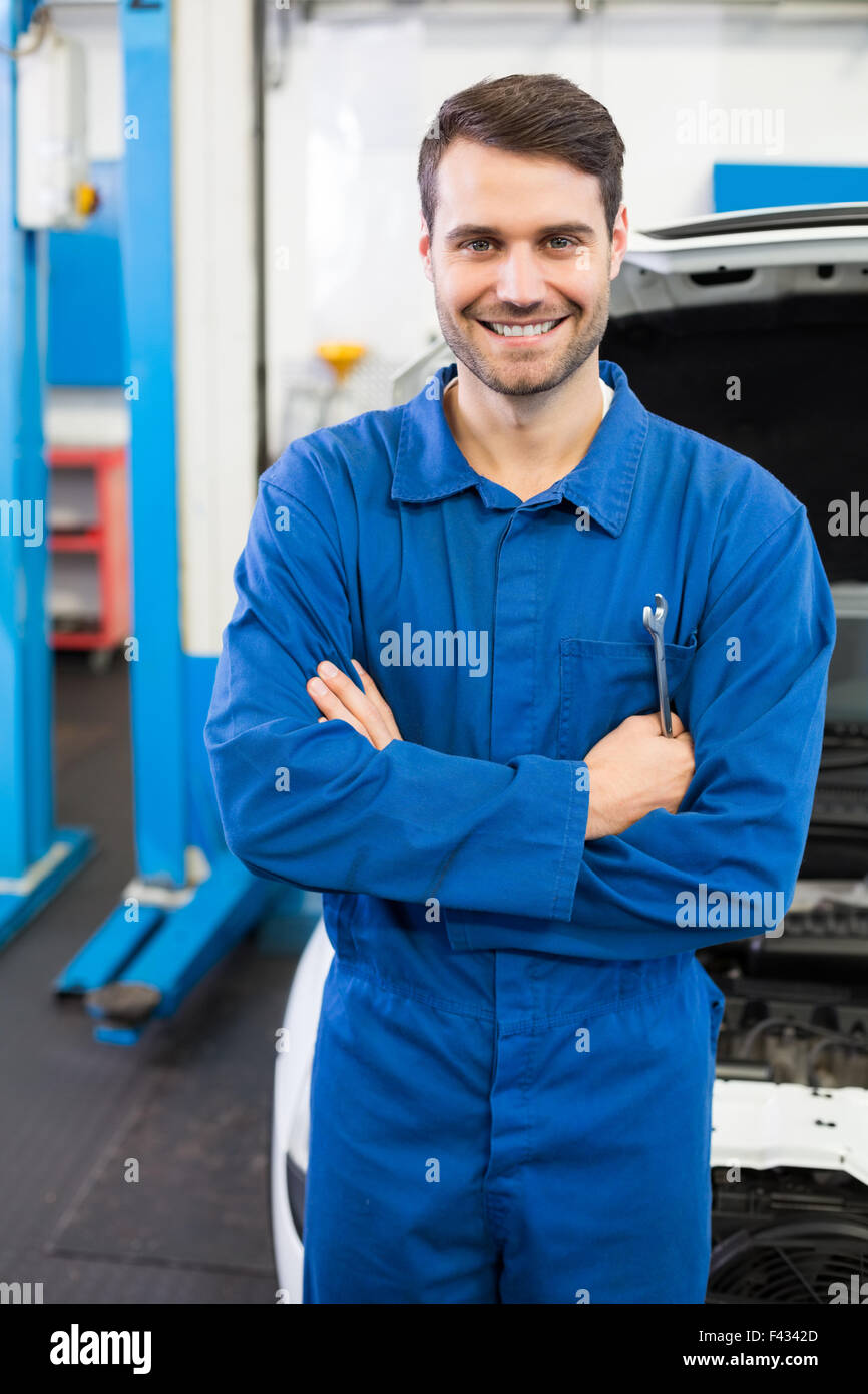 Mechanic smiling at the camera Stock Photo - Alamy