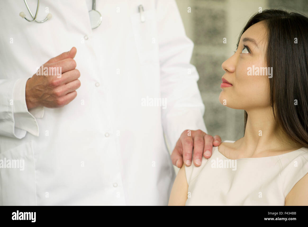 Woman receiving test results from doctor, cropped Stock Photo - Alamy