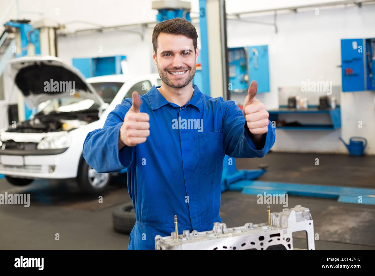 Mechanic working on an engine Stock Photo - Alamy