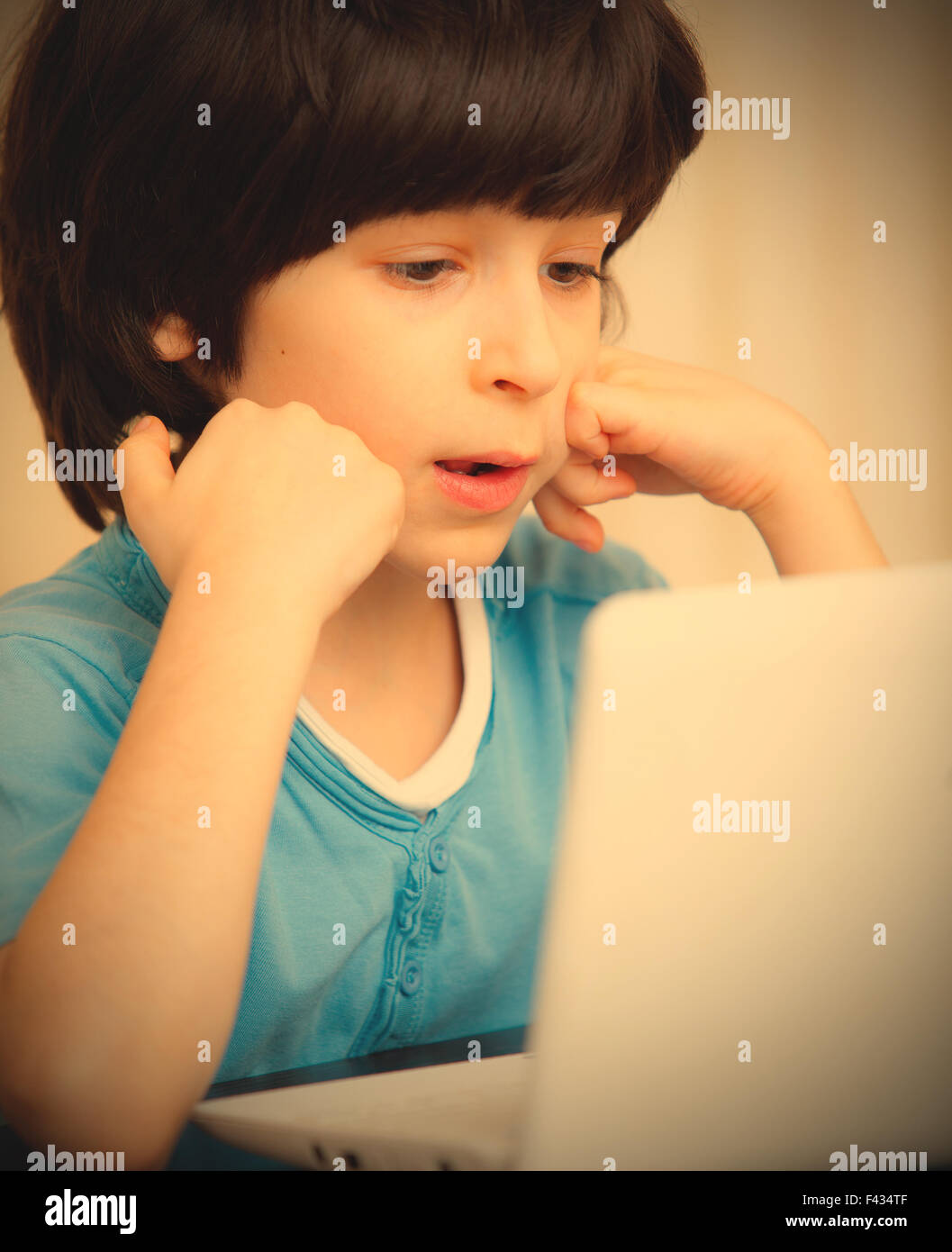 Boy with white laptop hi-res stock photography and images - Alamy