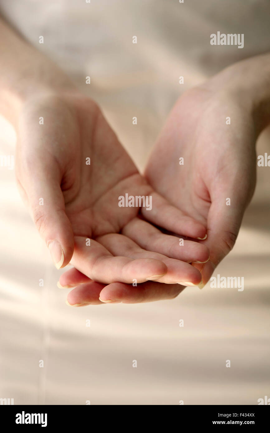 Woman's cupped hands, close-up Stock Photo - Alamy