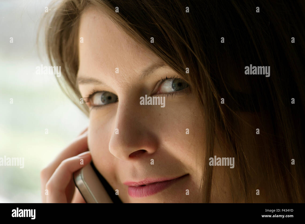 Woman using cell phone Stock Photo - Alamy