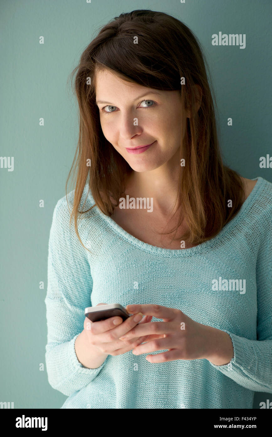 Woman uses smartphone browsing internet hi-res stock photography and ...