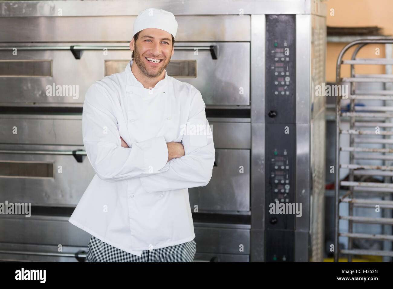 Smiling baker looking at camera Stock Photo - Alamy