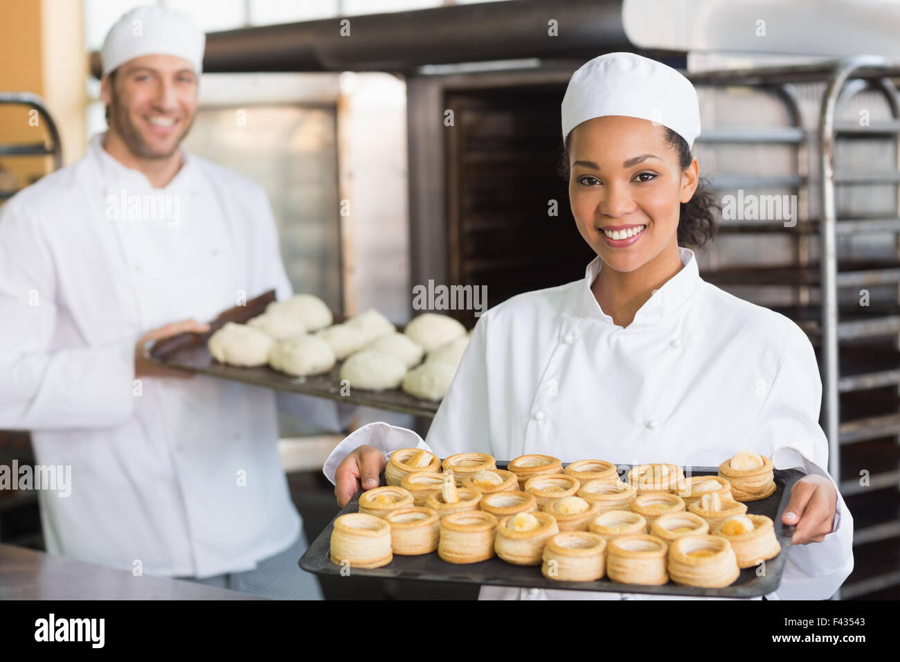 Smiling pastry chefs team hi-res stock photography and images - Alamy