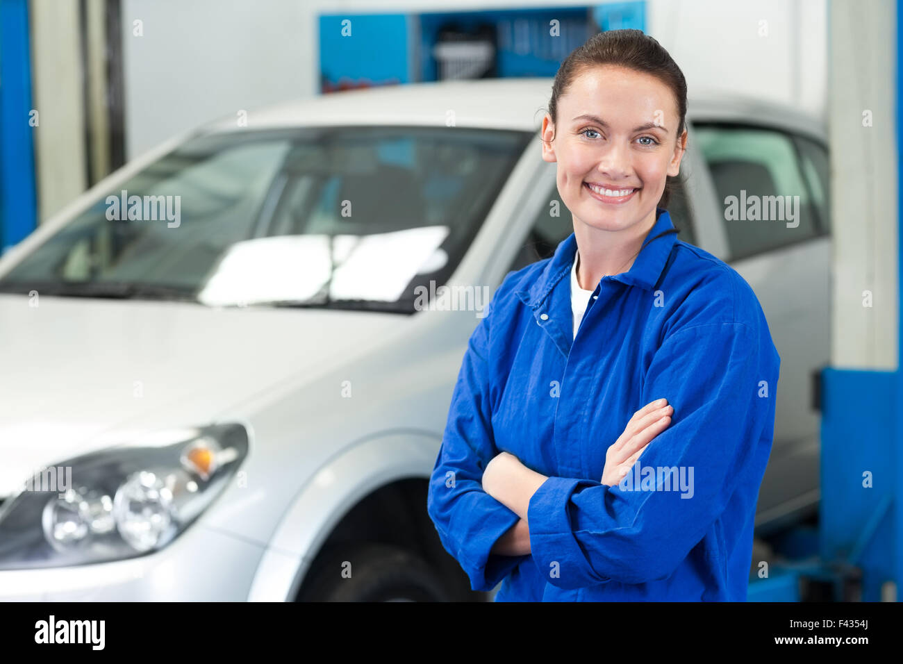 Mechanic smiling at the camera Stock Photo - Alamy
