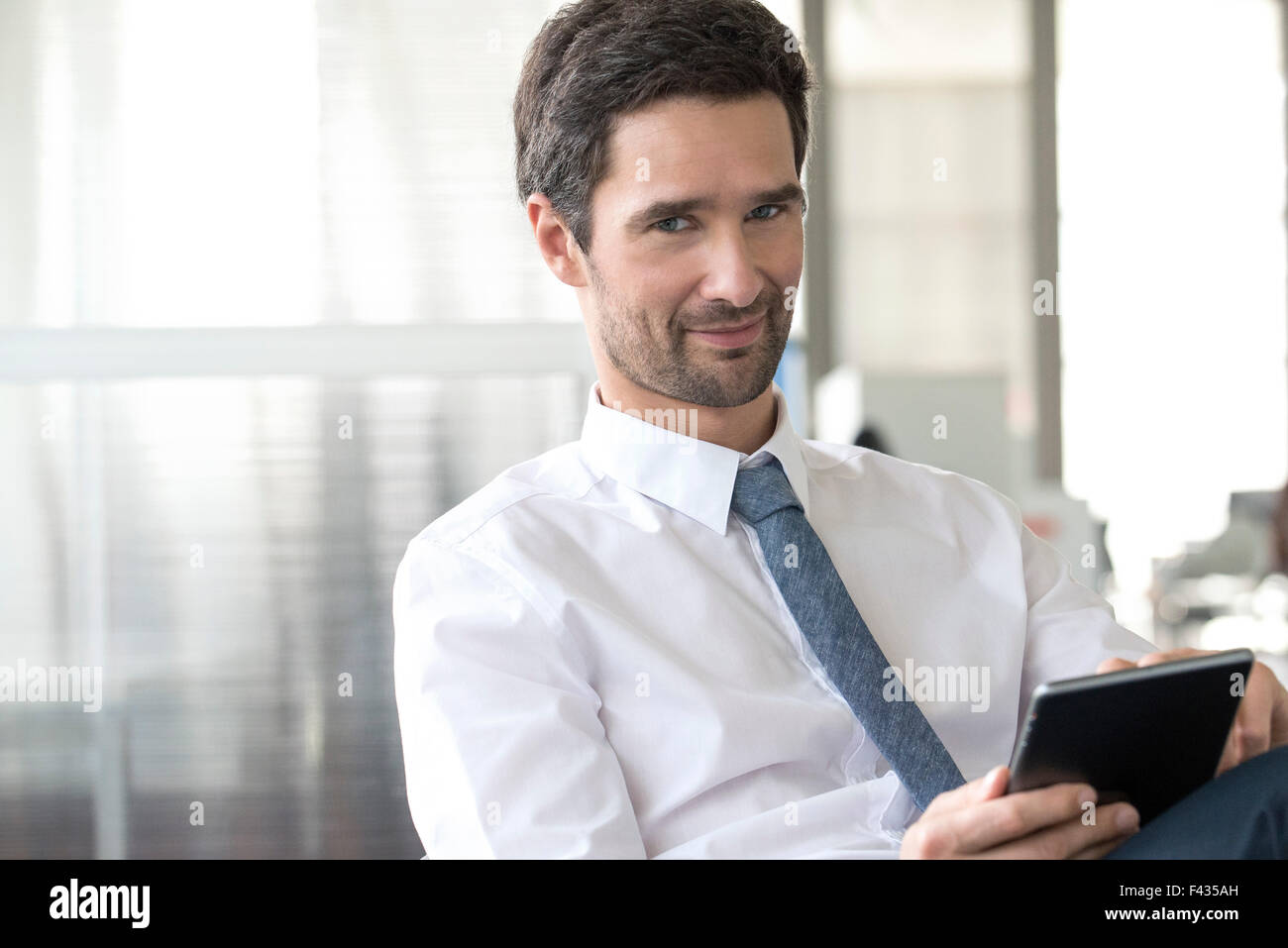 Businessman using digital tablet Stock Photo - Alamy Businessman using digital tablet Stock Photo - Alamy
