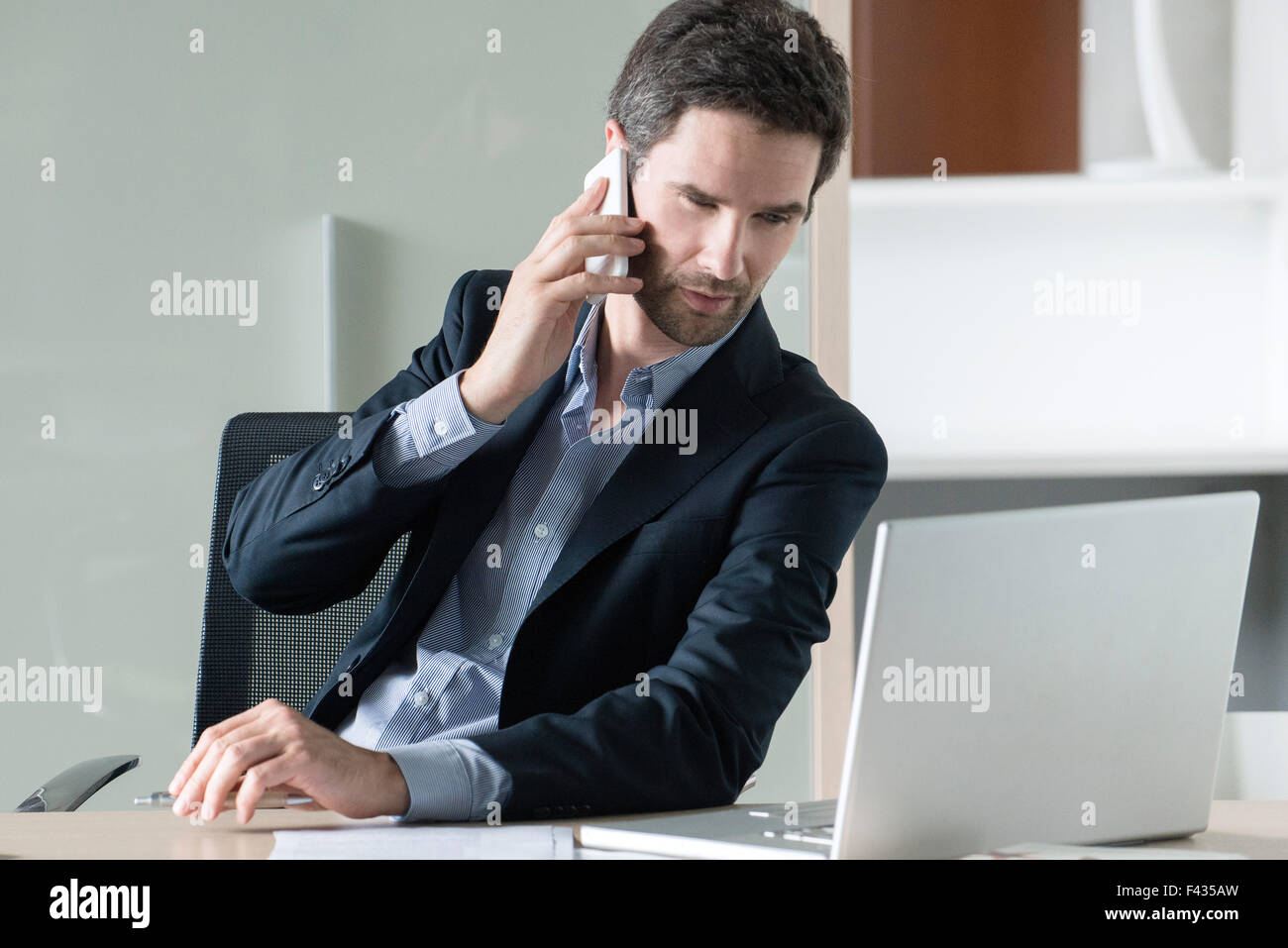 Businessman making phone call Stock Photo - Alamy